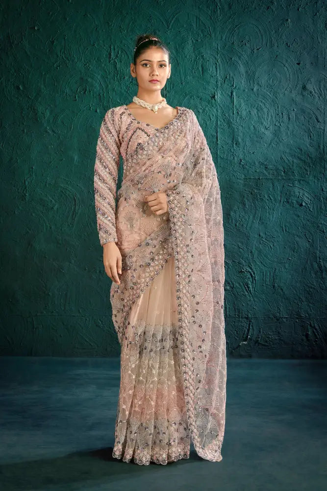 Light Up The Room In This Radiant Pink Net Saree With Stonework